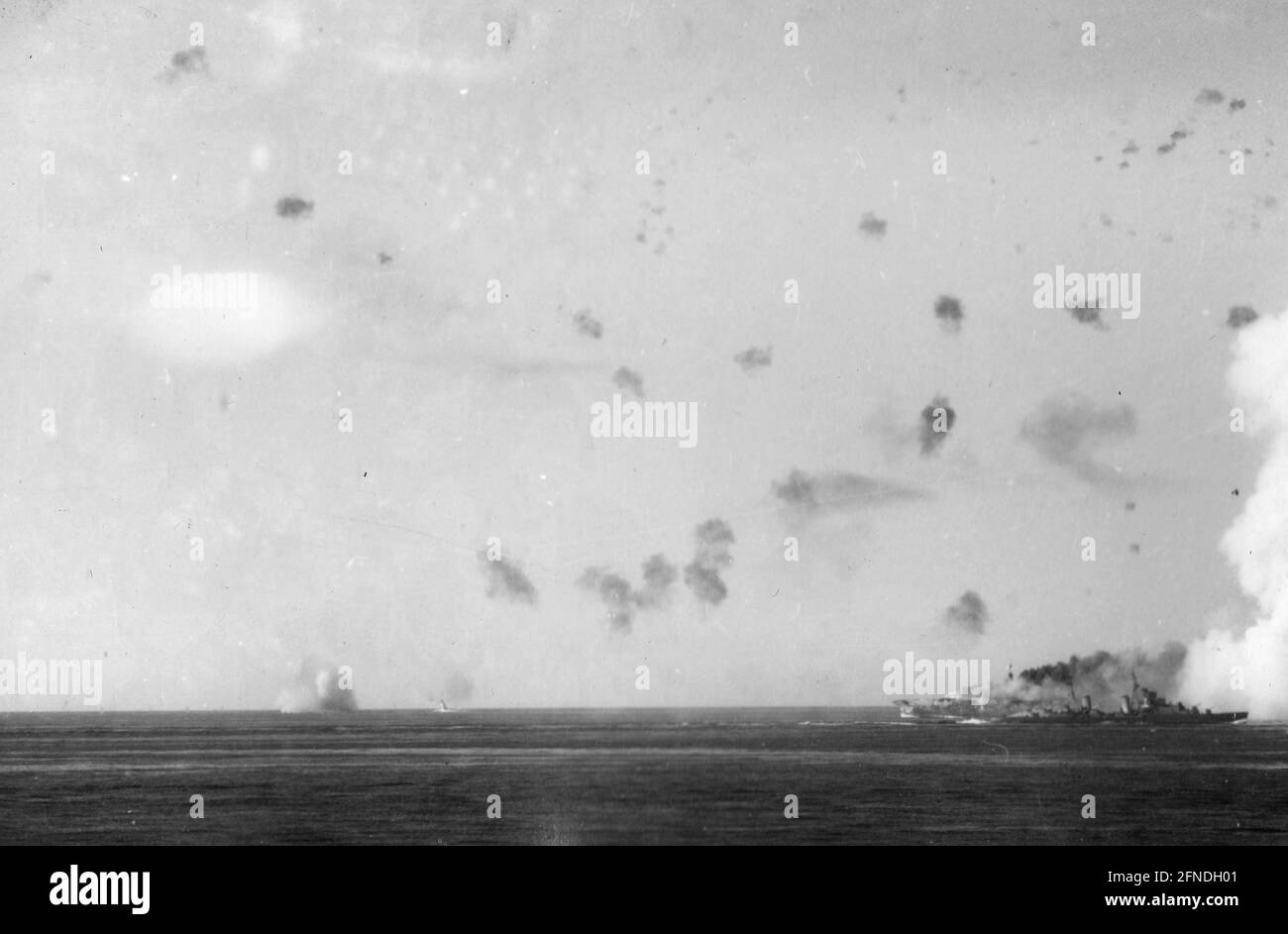 HMS Indomitable Under Attack Stock Photo - Alamy