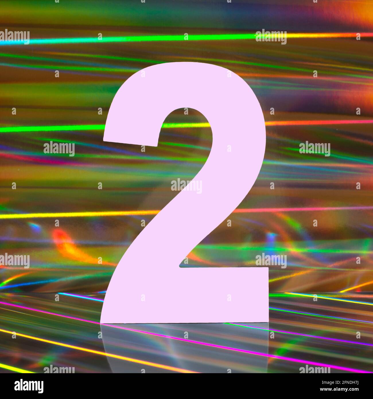 Number two on abstract multicolored holographic background. Disco ...