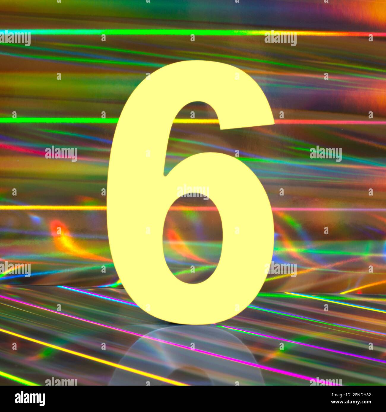 Number six on abstract multicolored holographic background. Disco ...