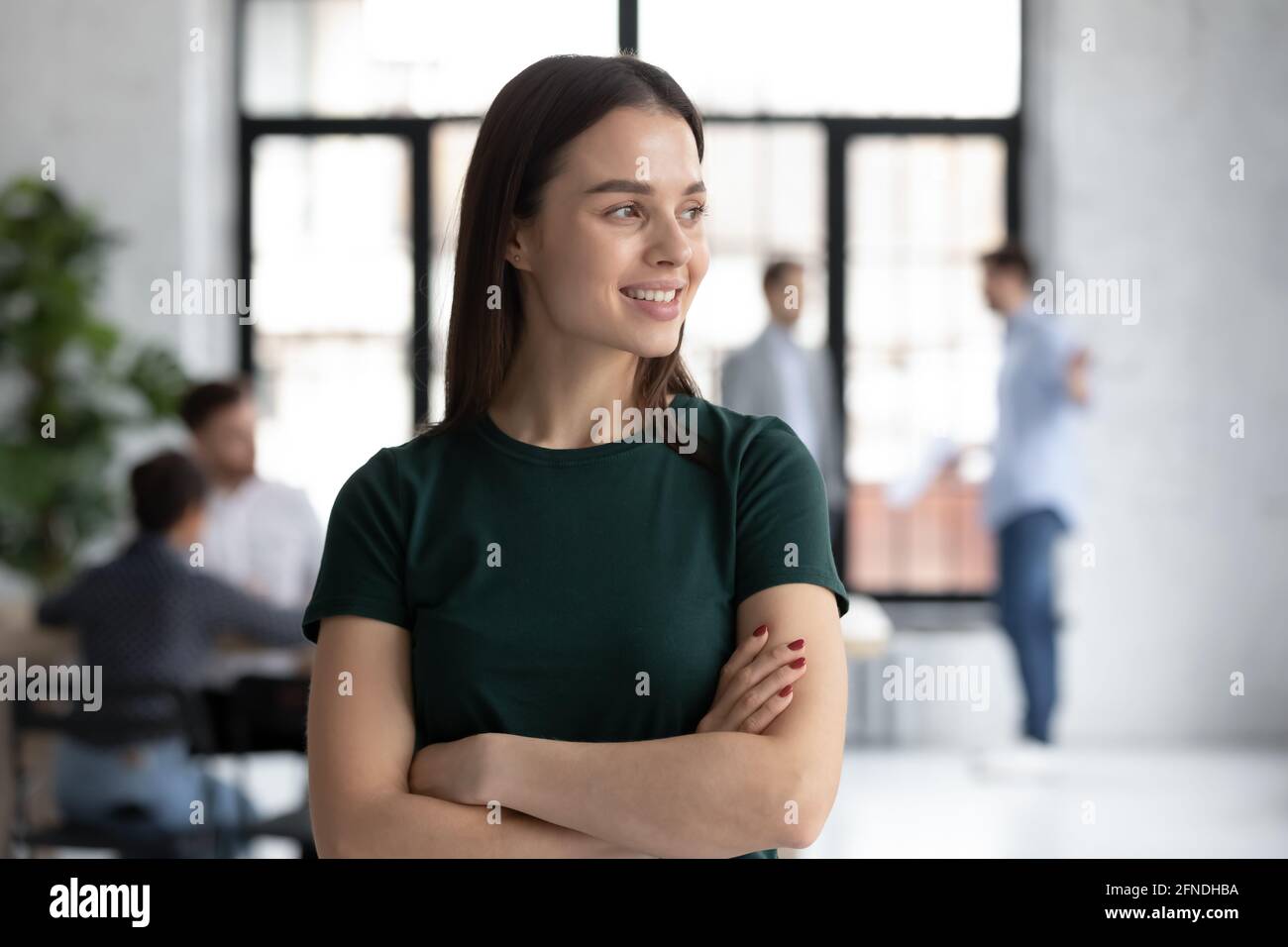 Portrait of happy young female team leader planning project future ...