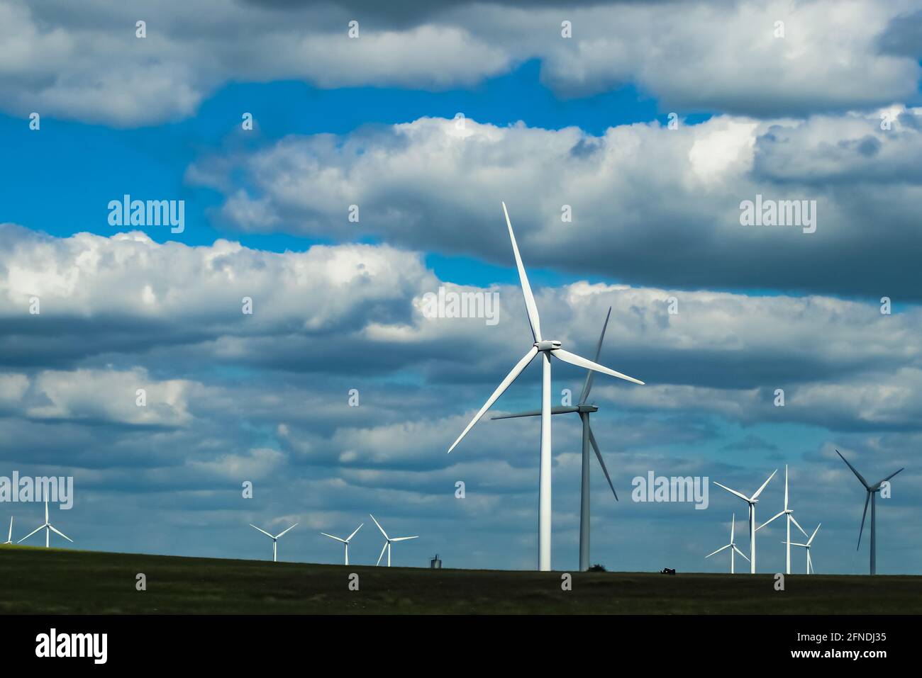 Windmills on the plains of Oklahoma under a dramatic cloudy sky Stock ...