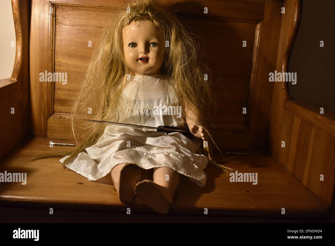 Doll sitting on chair hi-res stock photography and images - Alamy