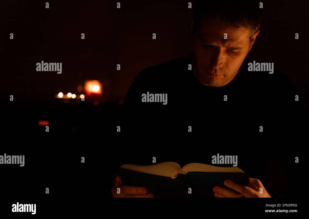 Reading candlelight home hi-res stock photography and images - Alamy