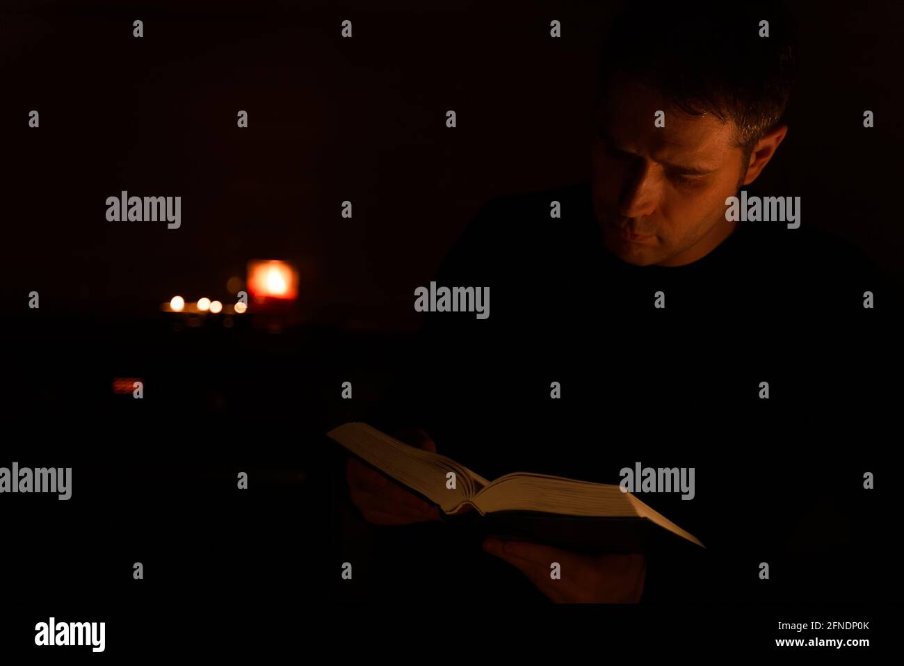 Reading candlelight home hi-res stock photography and images - Alamy