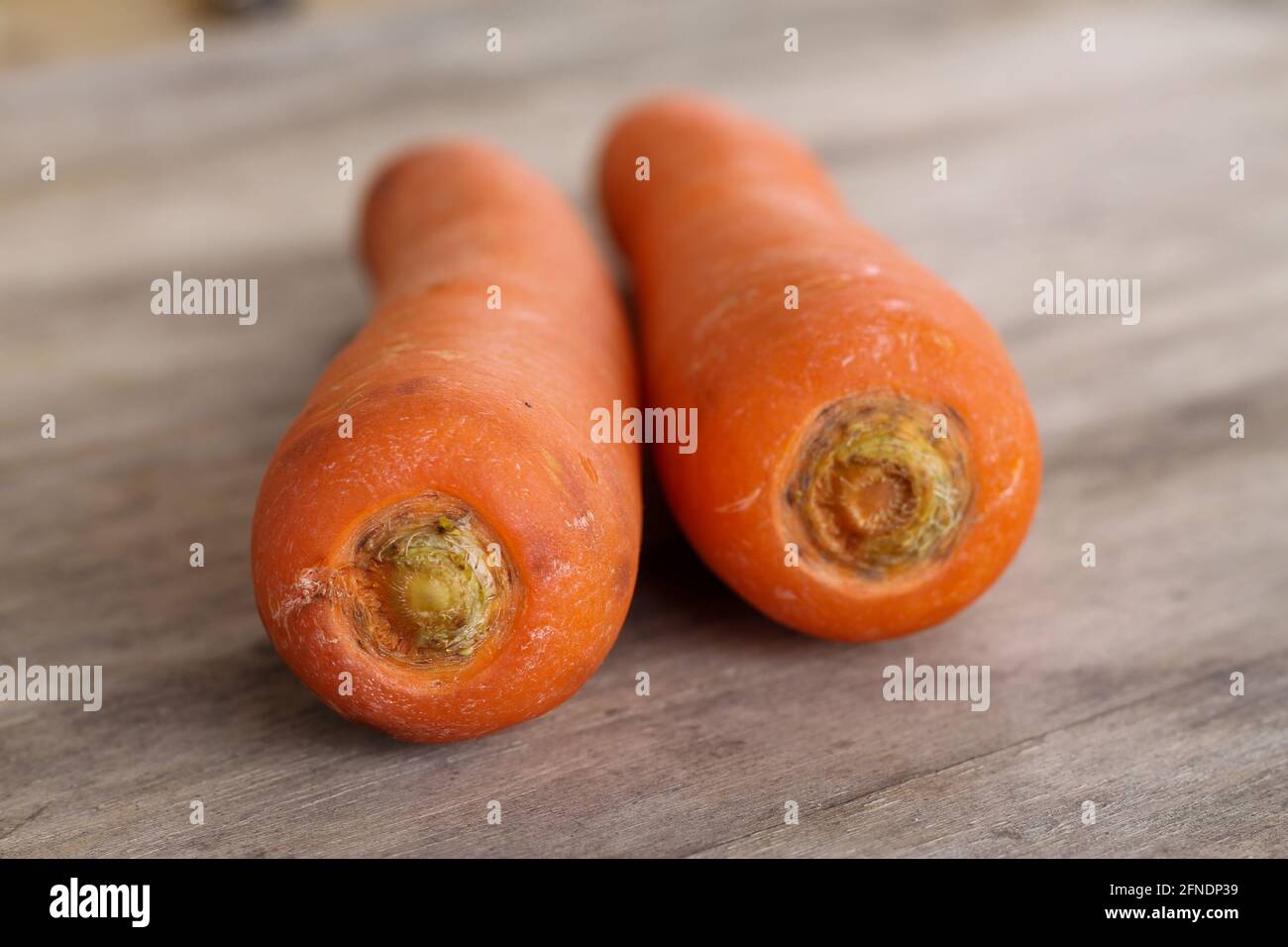 two carrots on an old wood background looks very beautiful Stock Photo ...