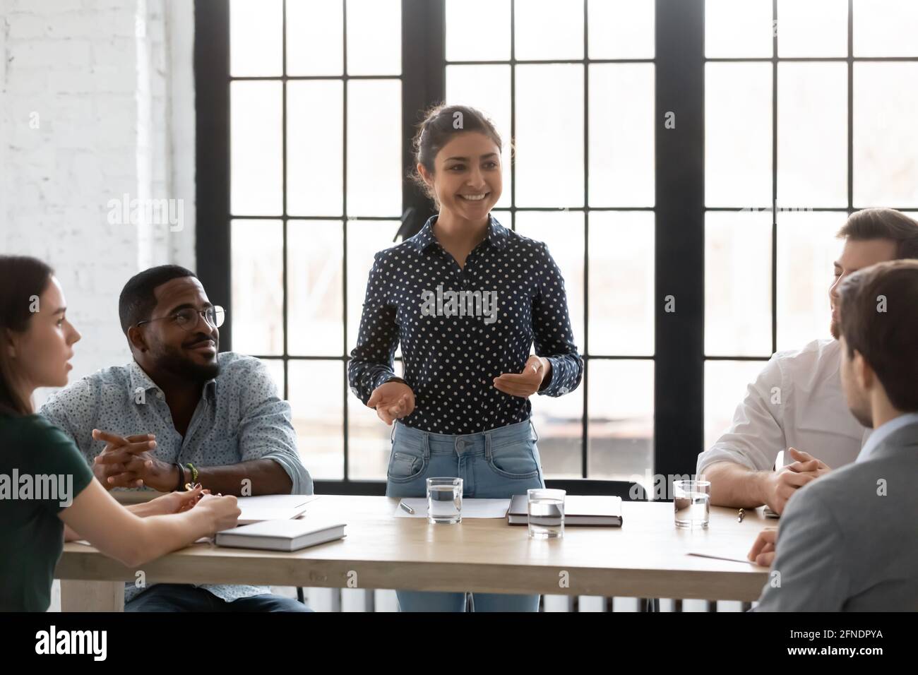Corporate manager speaking diverse team hi-res stock photography and ...