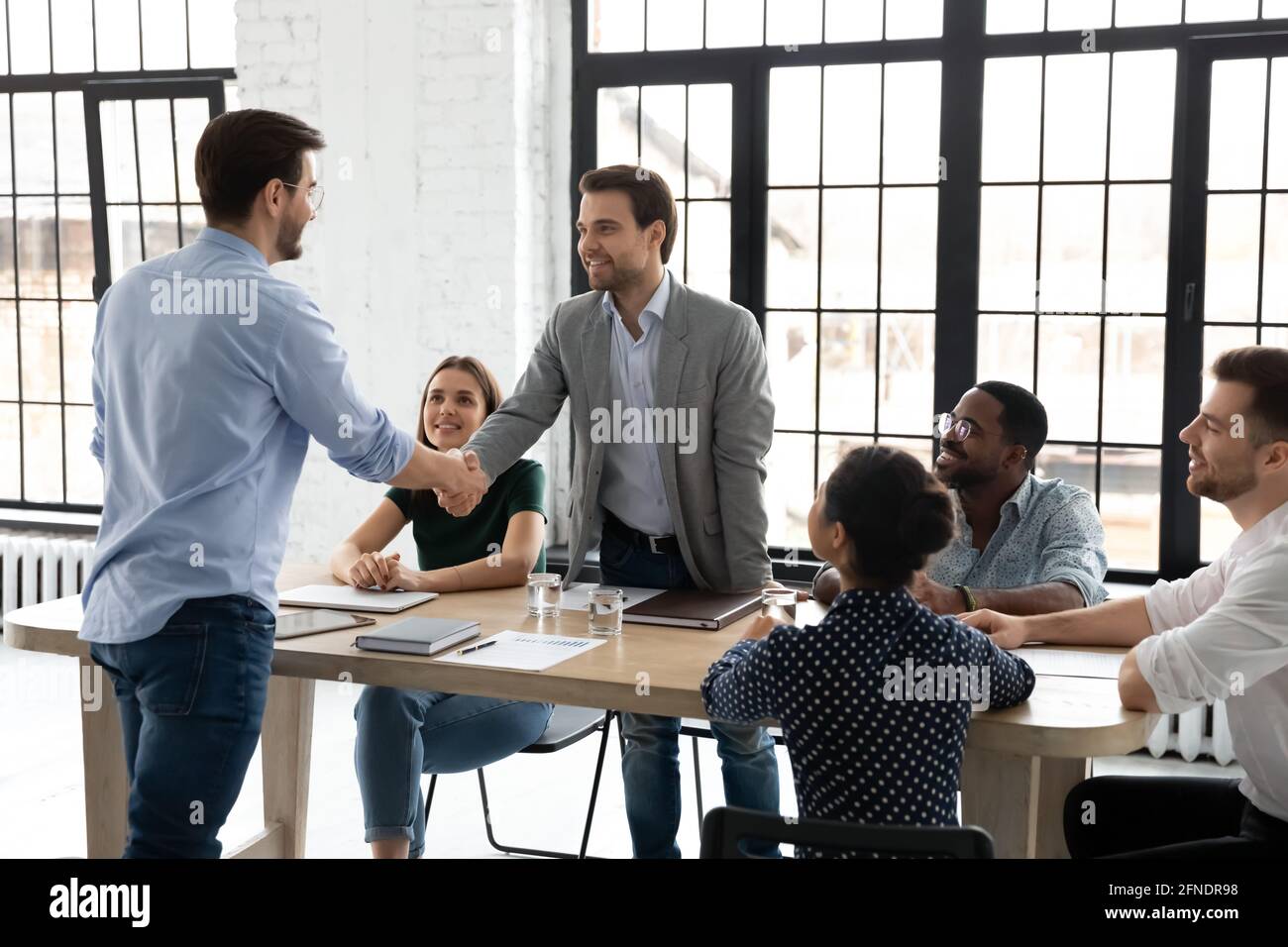 Welcoming new employee hi-res stock photography and images - Alamy