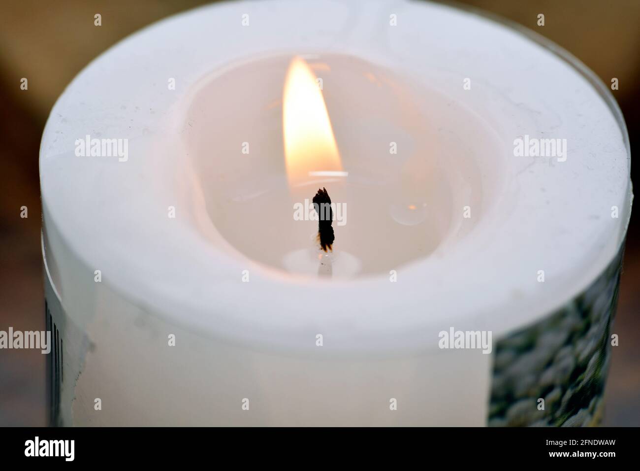 a burning candle, a closeup of a white wax candlelight flame Stock ...