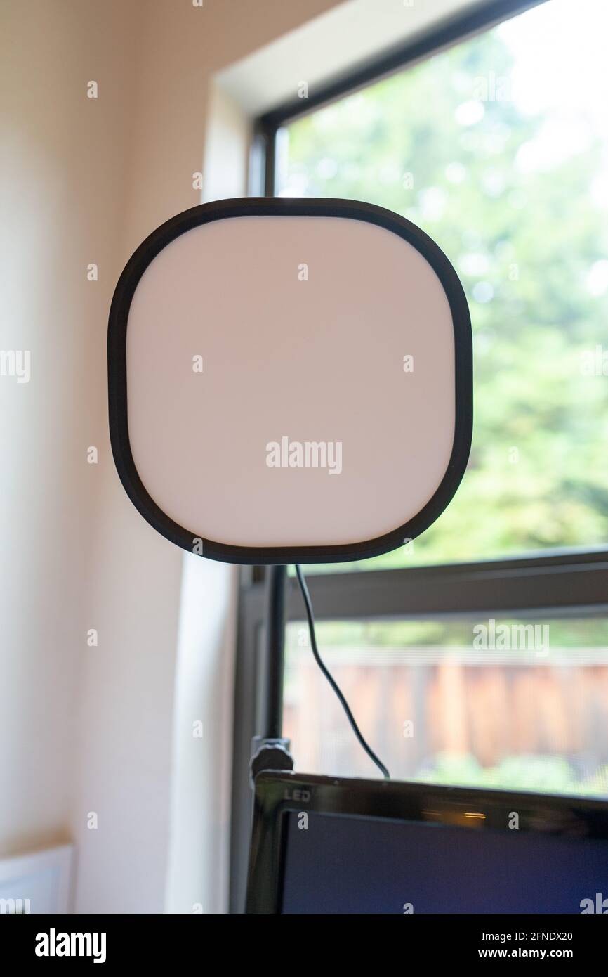 Close-up of an Elgato video conference light standing above an LED ...