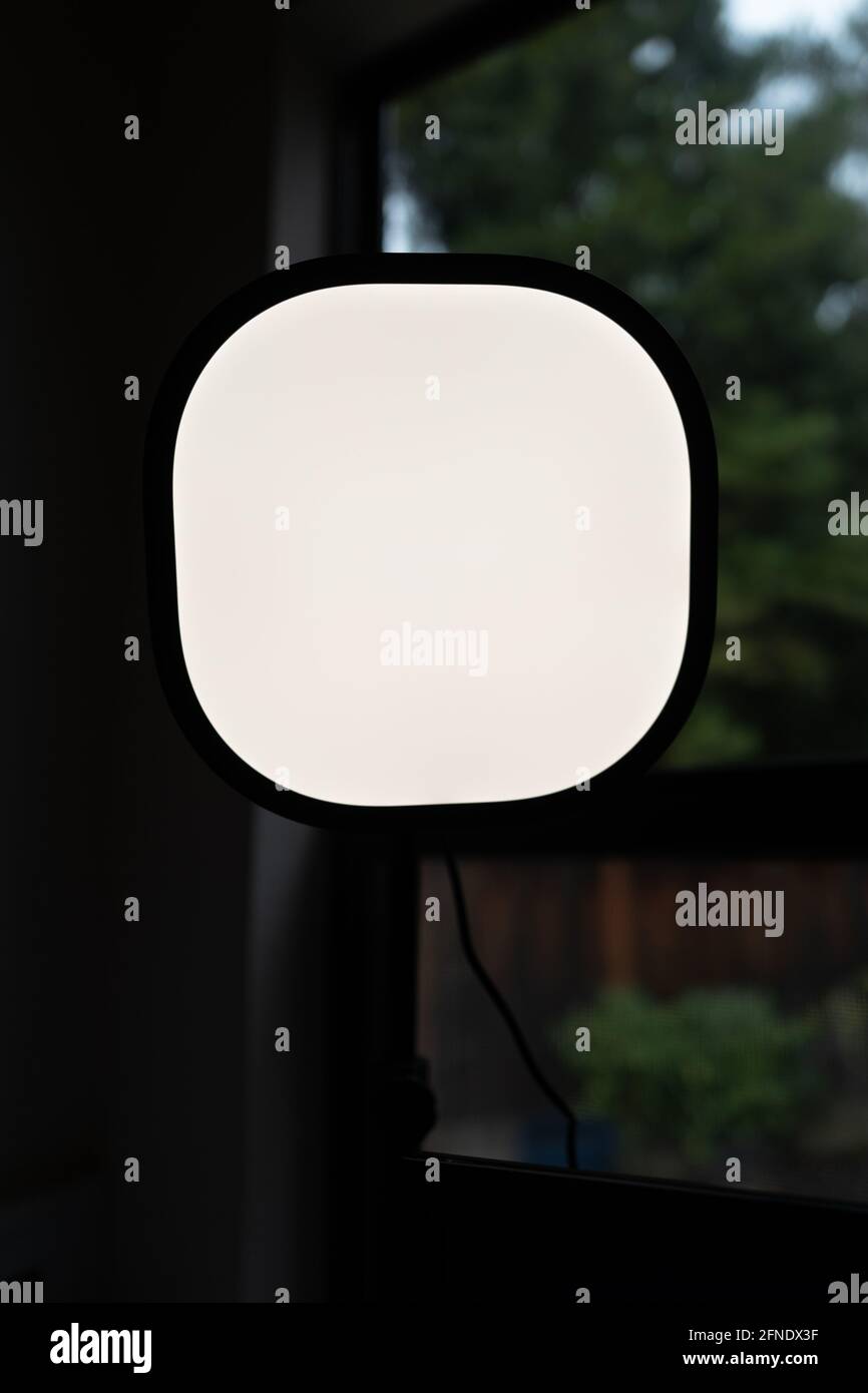 Close-up of an Elgato video conference light standing above an LED ...