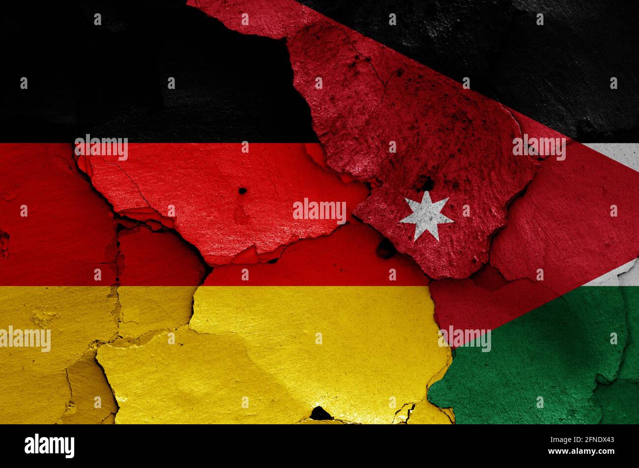 flags of Germany and Jordan painted on cracked wall Stock Photo - Alamy