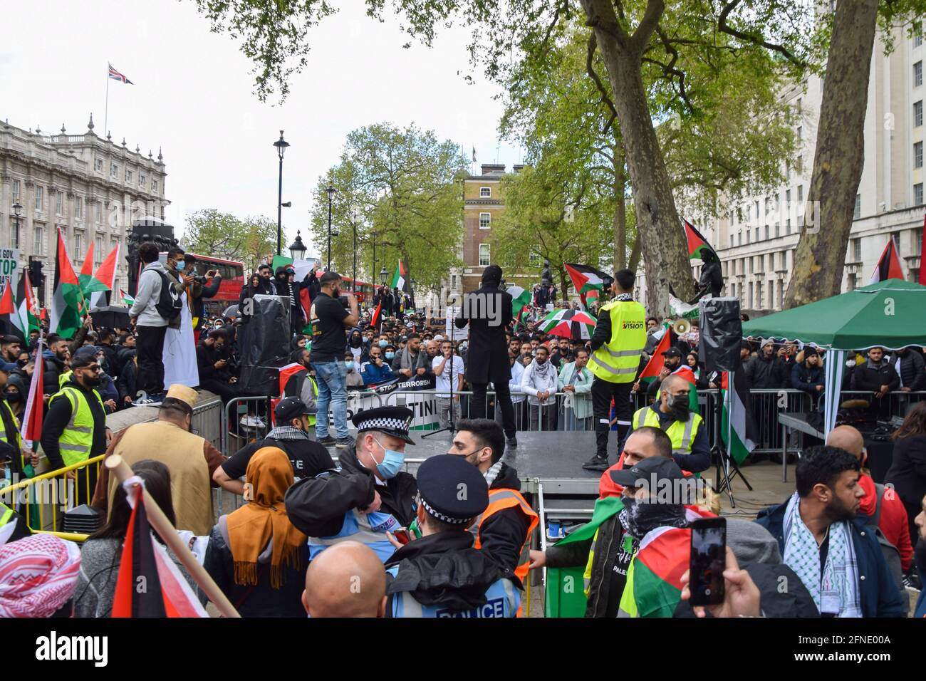 A speaker addresses the protesters outside Downing Street at the pro ...
