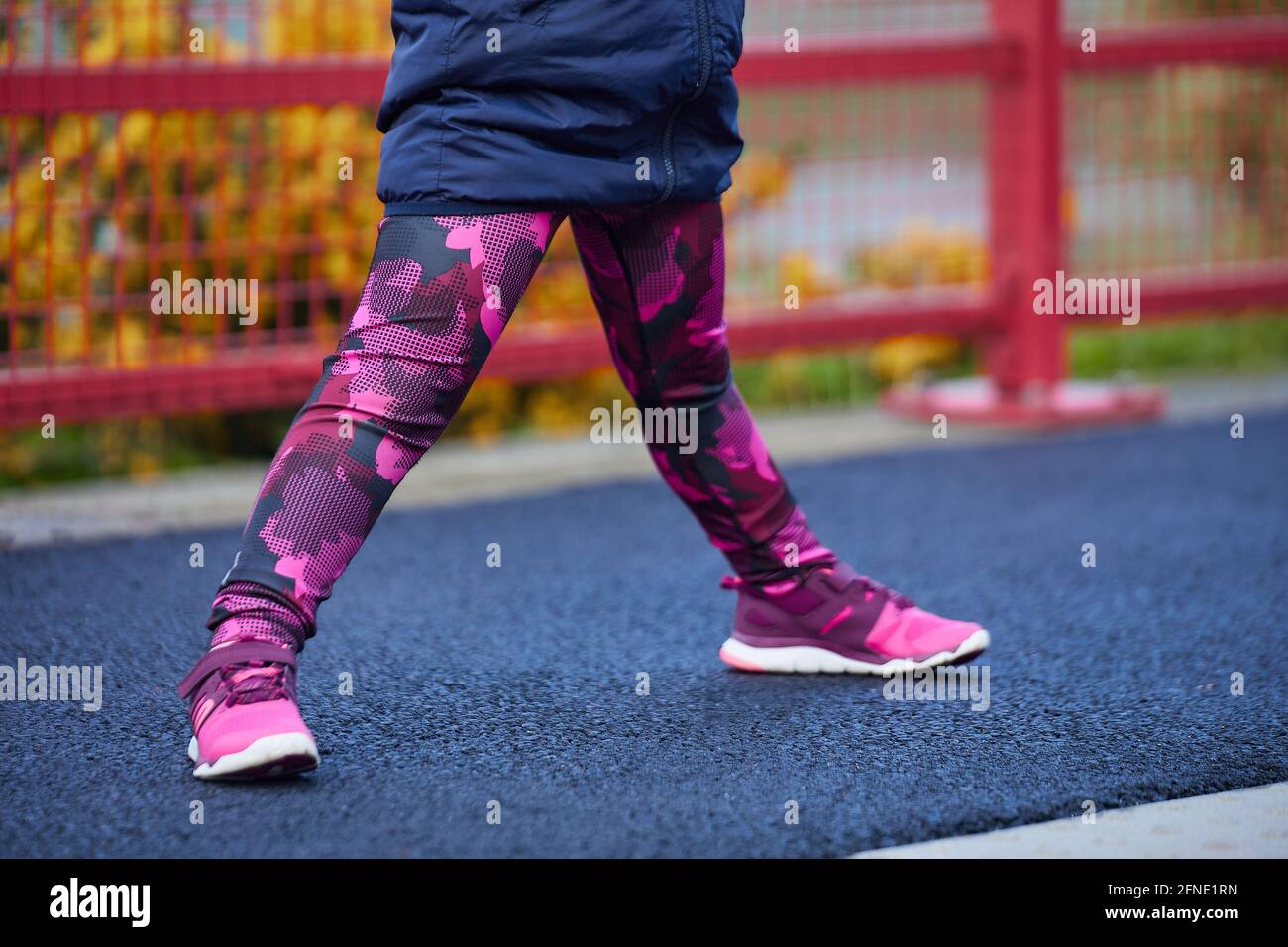 young kid doing stretches. portrait of legs with un recognizable face ...