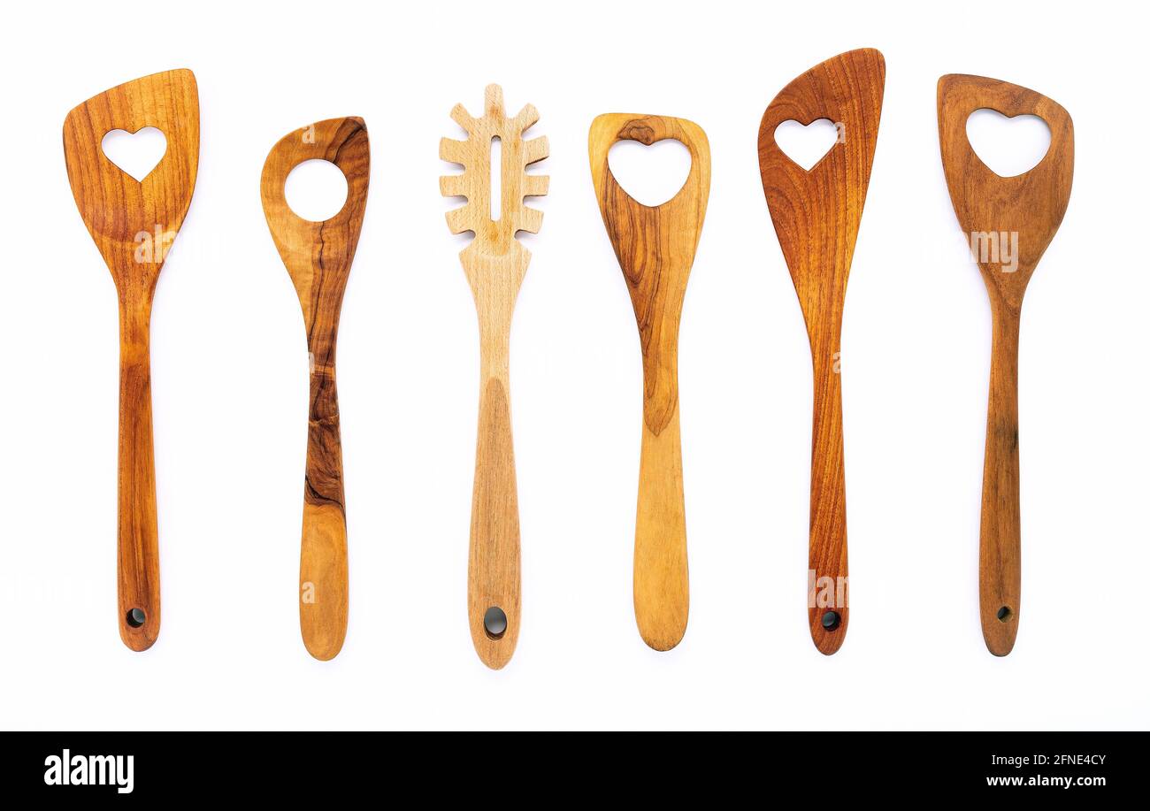 Various heart shape of wooden cooking utensils. Wooden spoons and ...