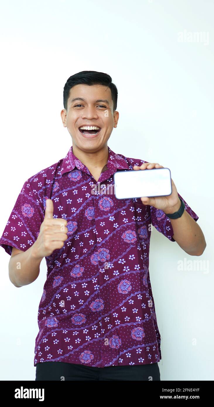 Excited man holding smartphone hi-res stock photography and images - Alamy