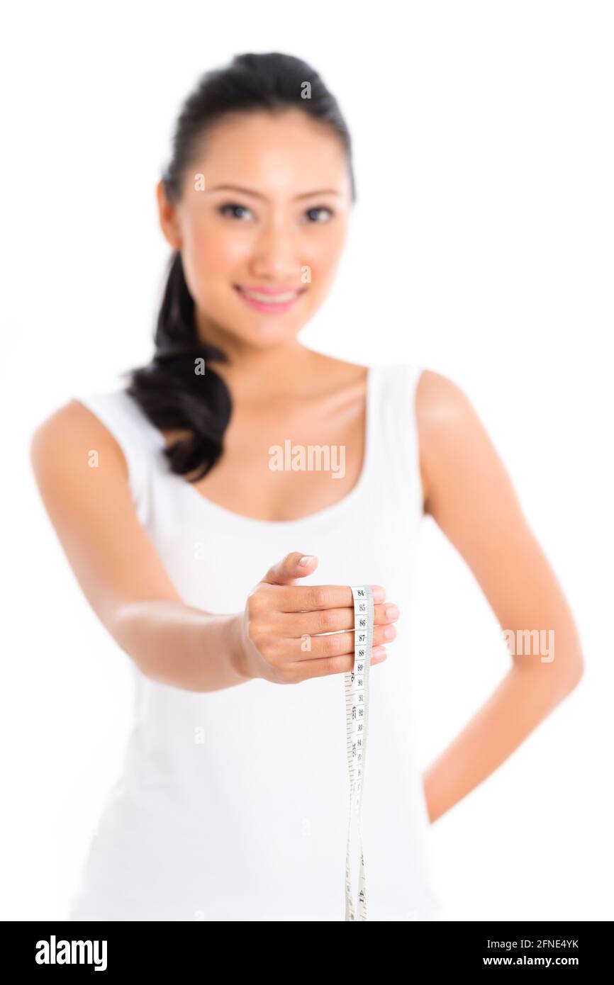 Asian woman measuring body Stock Photo - Alamy