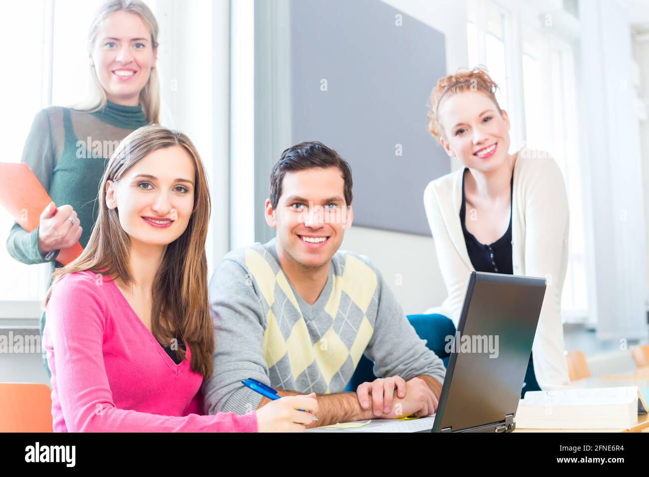 University college students using laptop for project team work learning ...