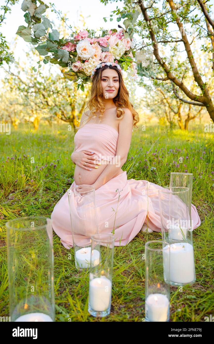 Happy expectant woman stroking belly hi-res stock photography and ...