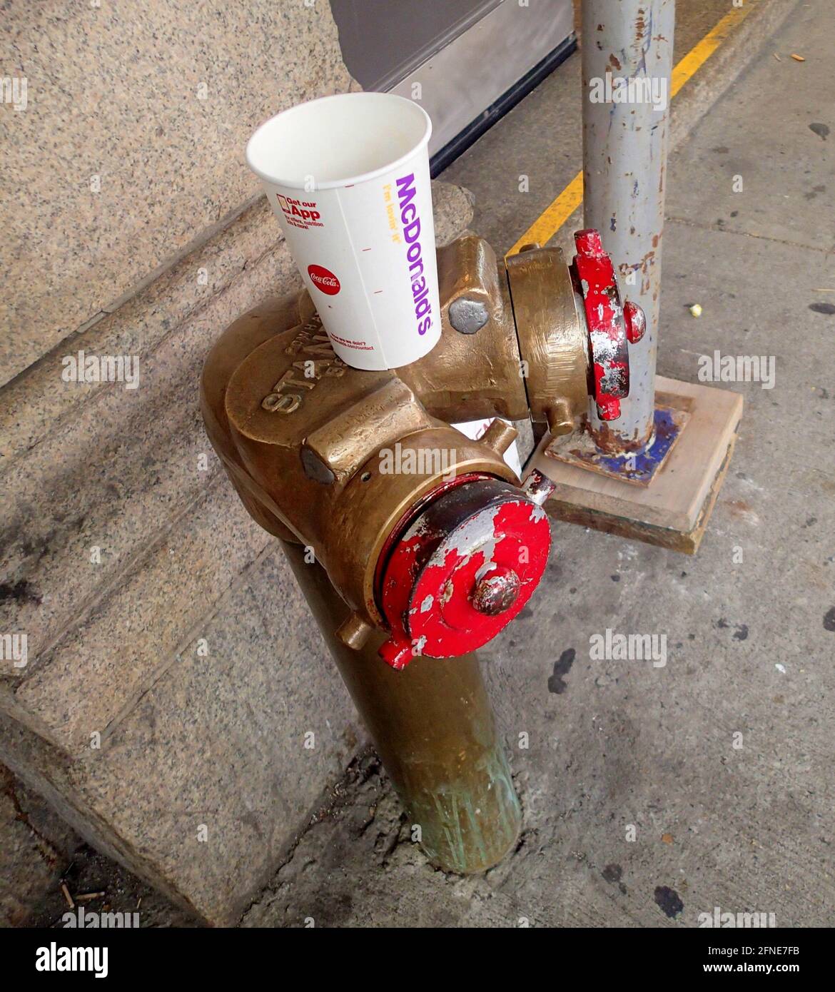 An empty McDonald's drink container left on a New York fire hydrant ...
