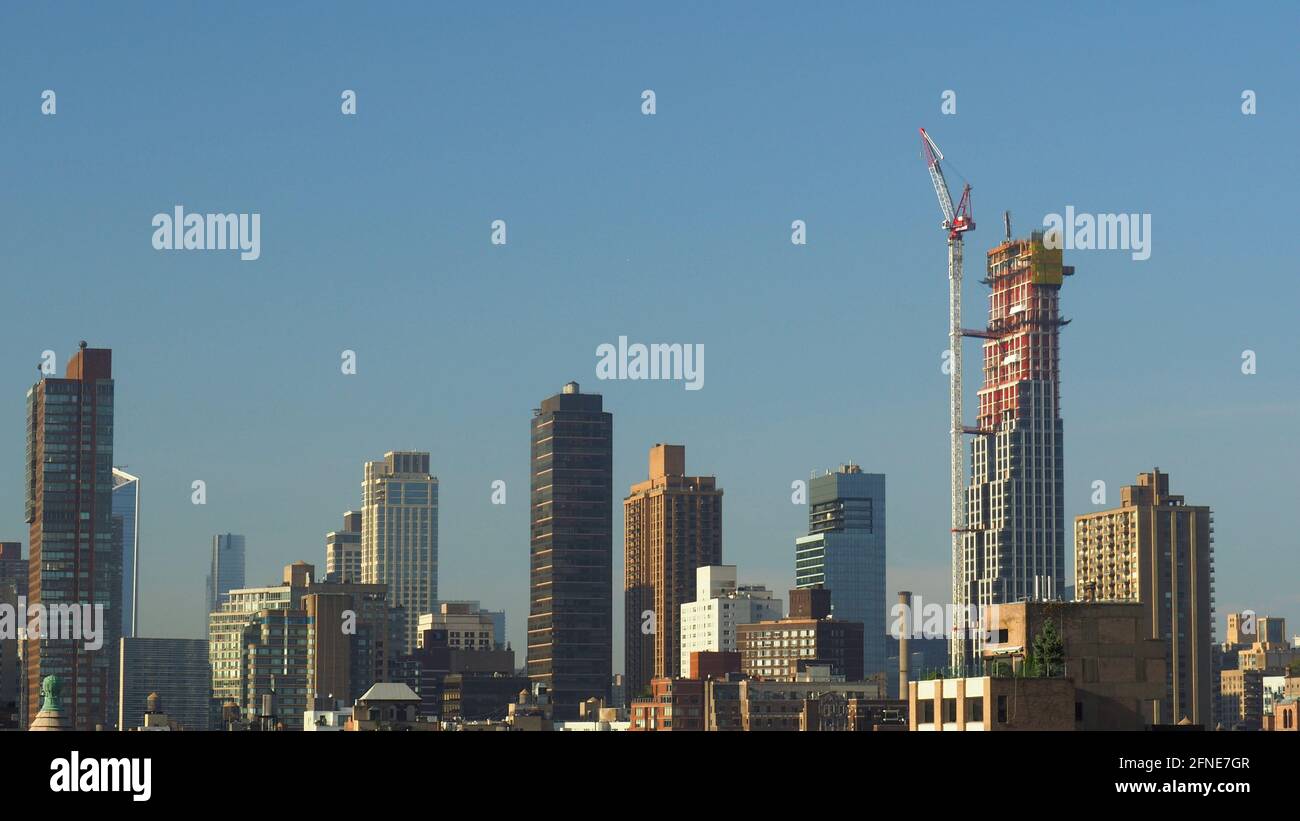 Upper Manhattan skyline with stepped skyscraper under construction ...