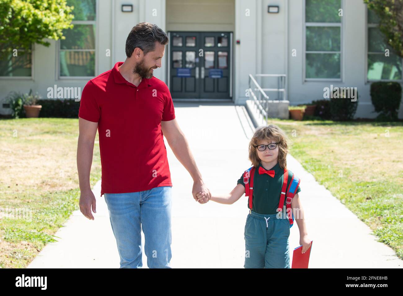 School boy going to school with father Stock Photo - Alamy