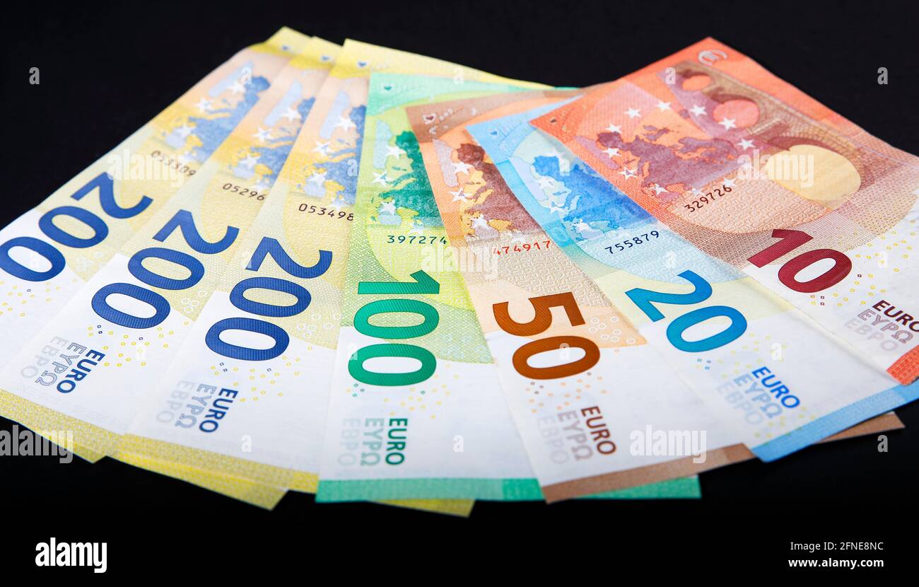 Various euro banknotes on black background, Germany Stock Photo - Alamy