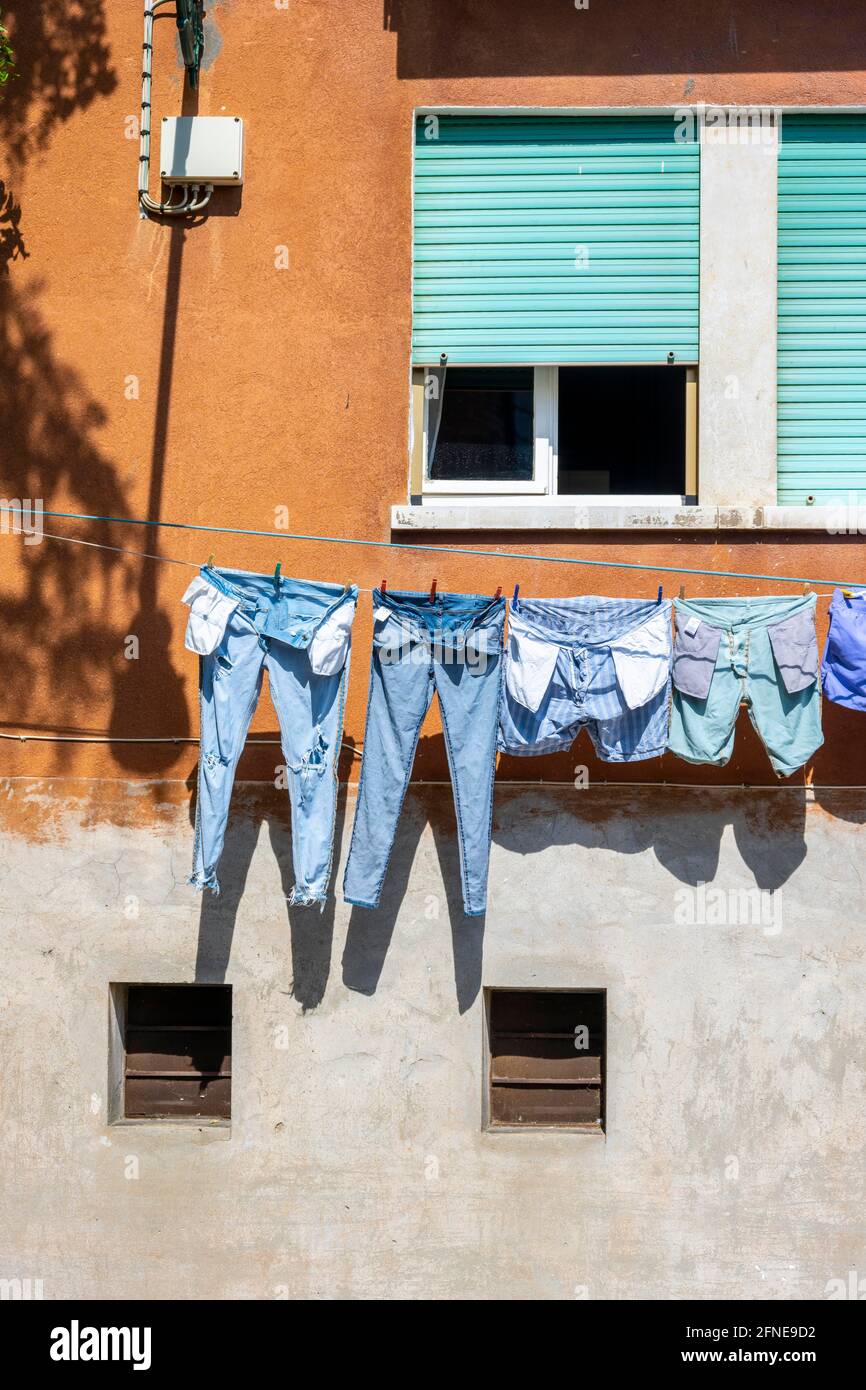 Laundry on clothesline at house hi-res stock photography and images - Alamy