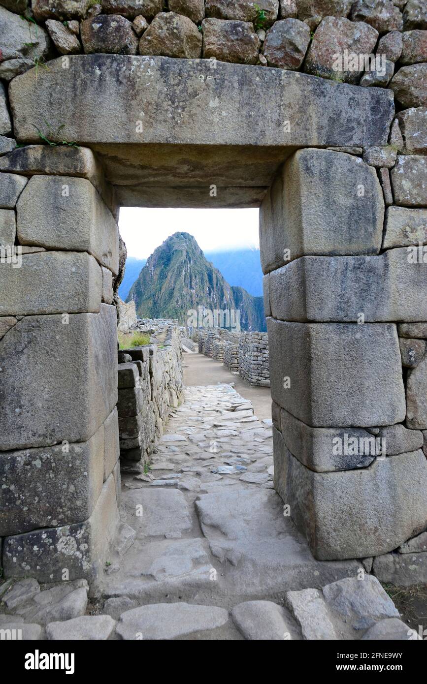 Gate in the ruined city of the Incas at dawn with Mount Huayna Picchu ...