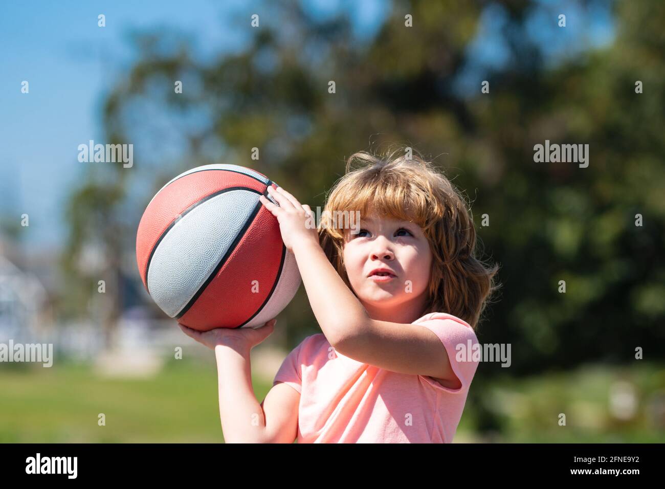 Child Shooting Basketball