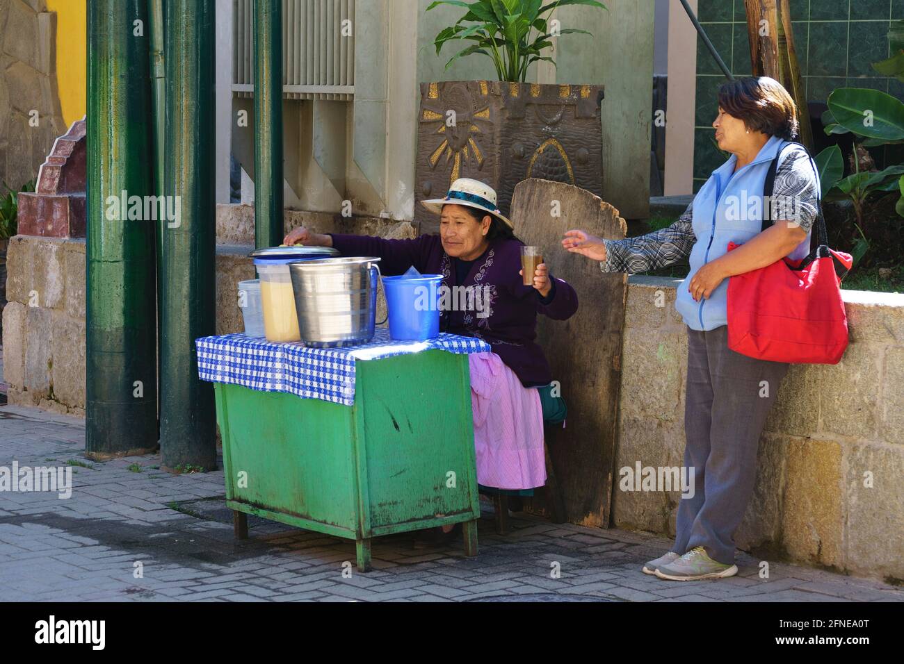 Old woman selling juices at the train station, Aguas Calientes, Machu ...