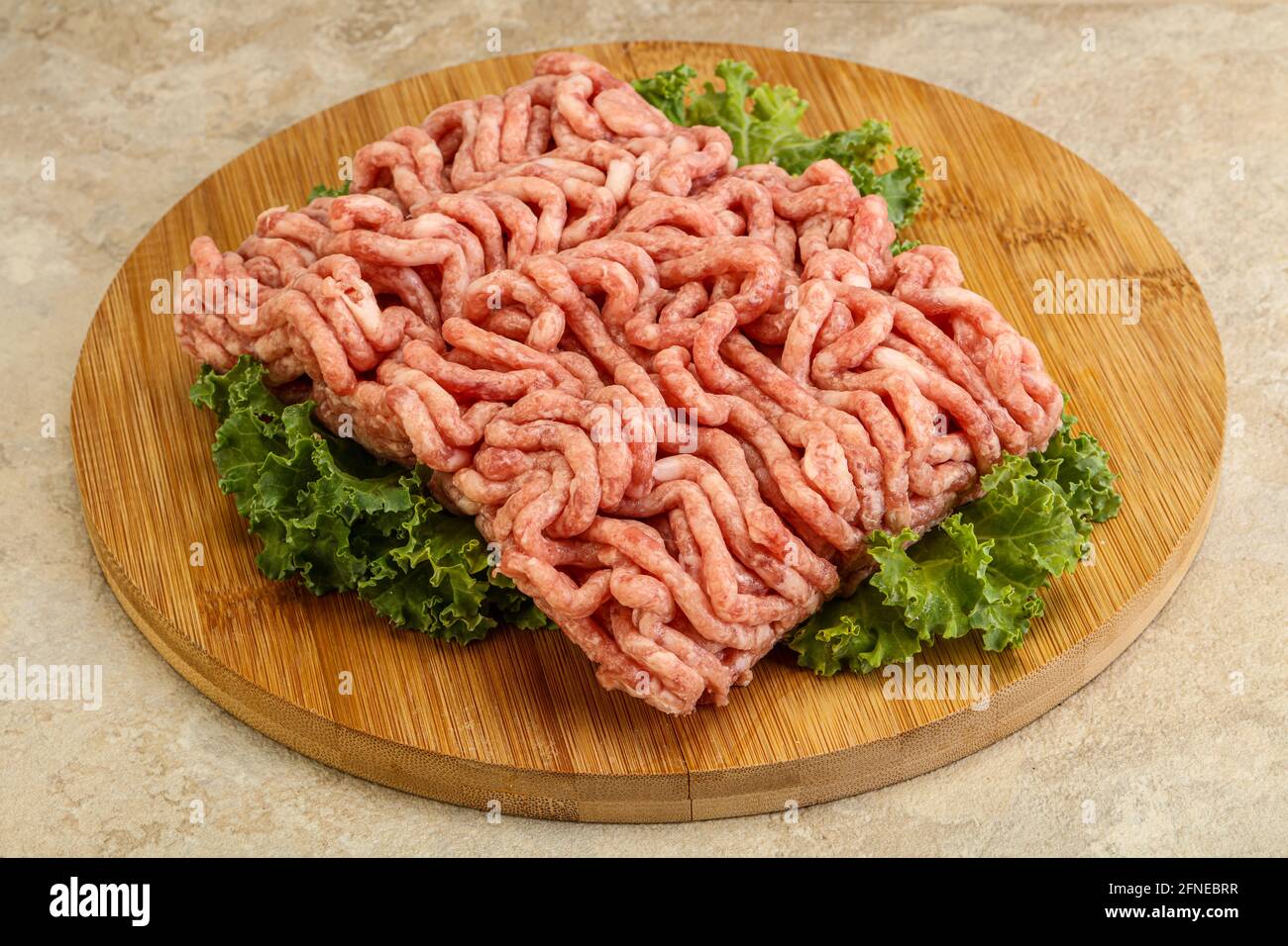Raw pork minced meat over board for cooking Stock Photo - Alamy