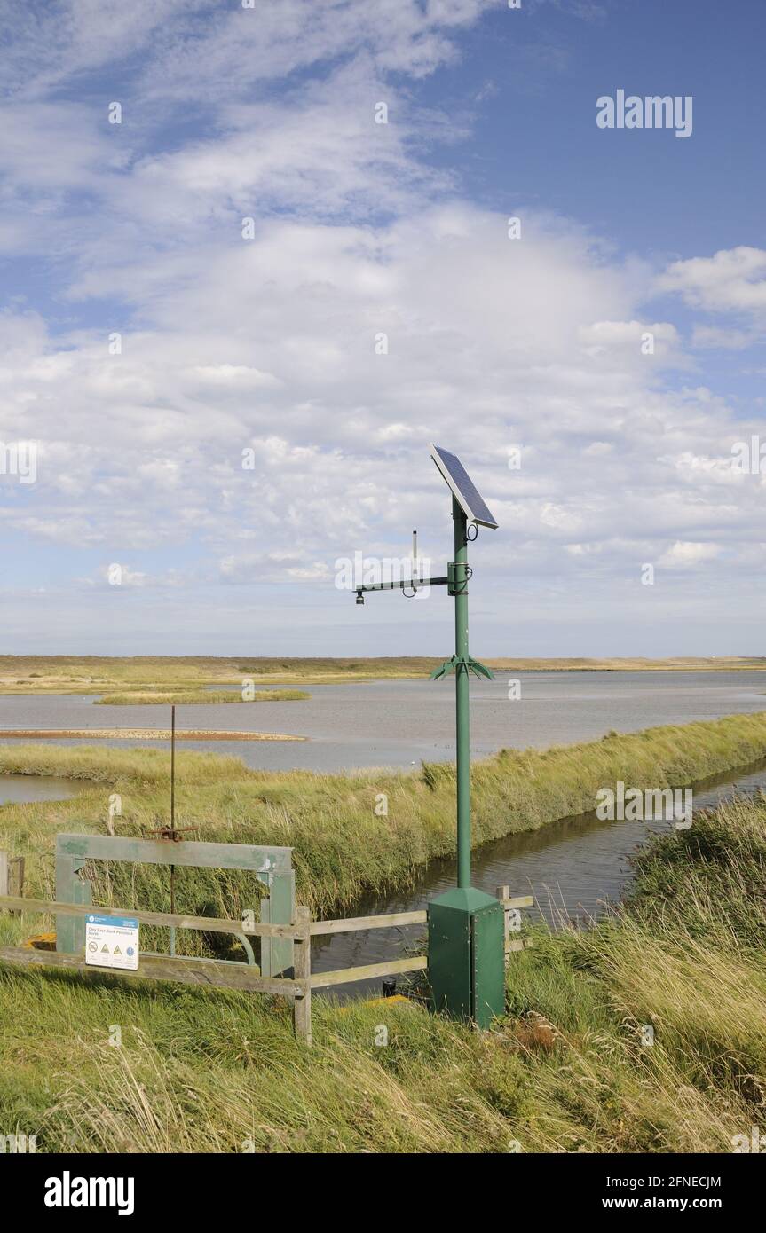 Solar powered water control station, sluice gate in marshland habitat ...