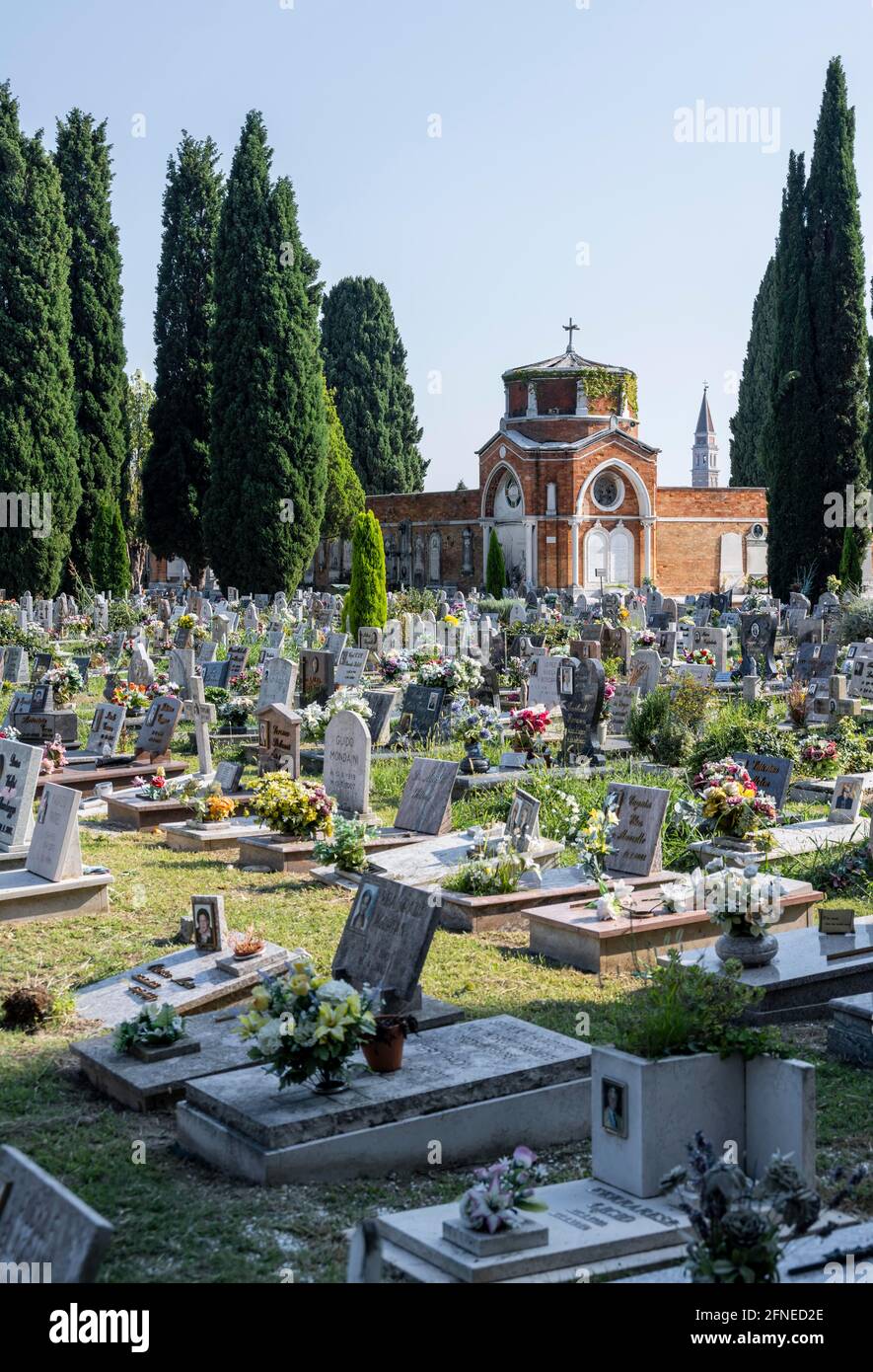 Graves with flower decorations, cemetery island San Michele, Venice ...