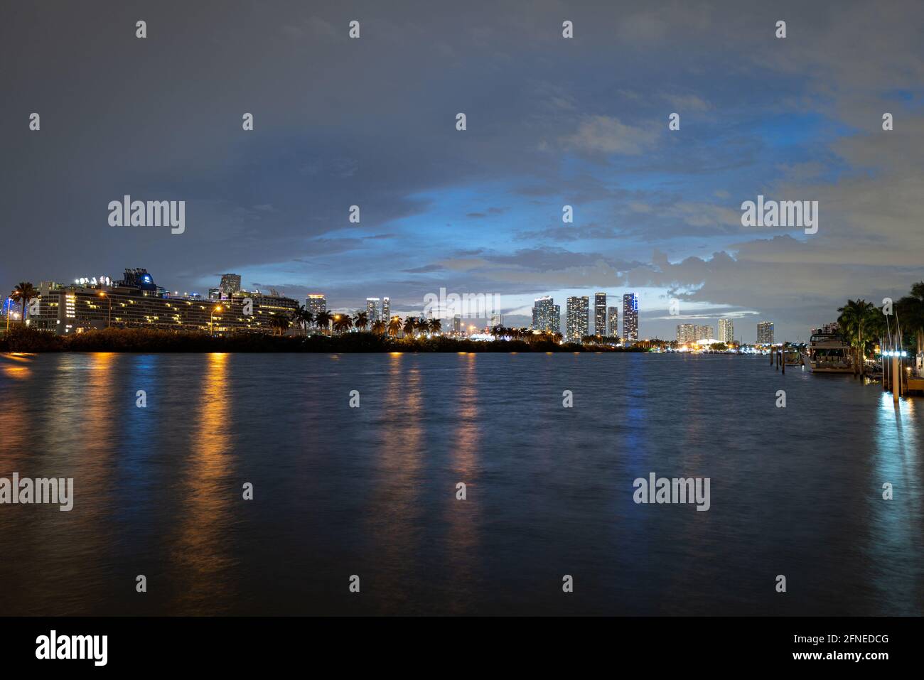 Miami night. Cruise ship in the Port of Miami at sunset with multiple ...