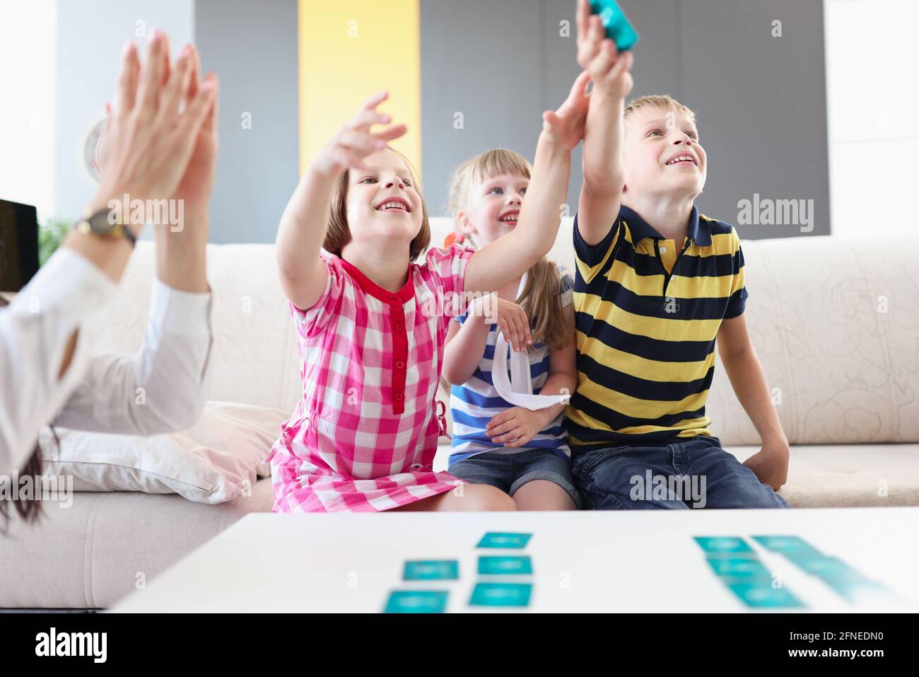 Joyful happy children play board home game Stock Photo - Alamy