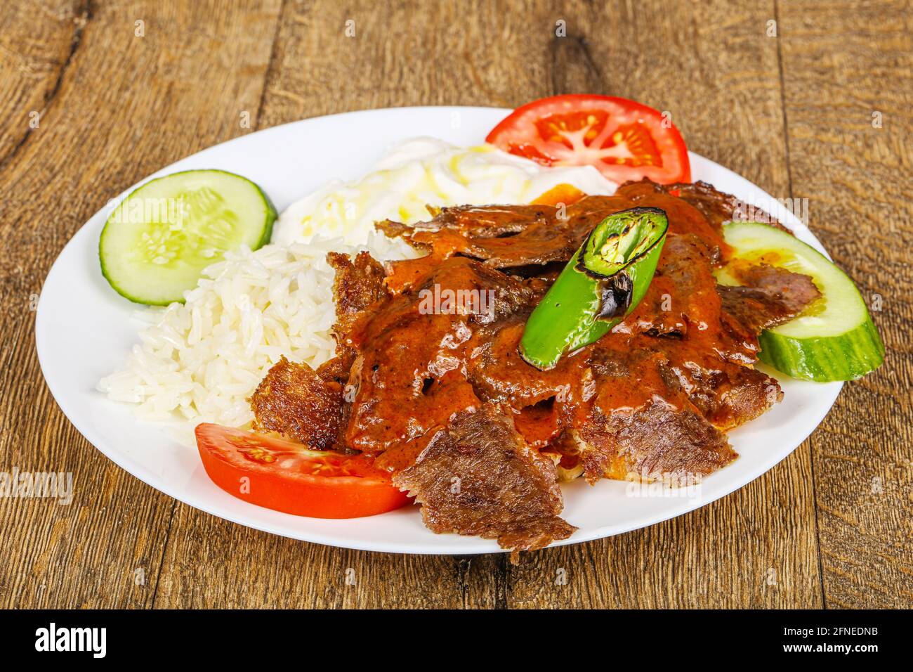 Turkish cuisine - Iskander kebab grilled meat with sauce Stock Photo ...