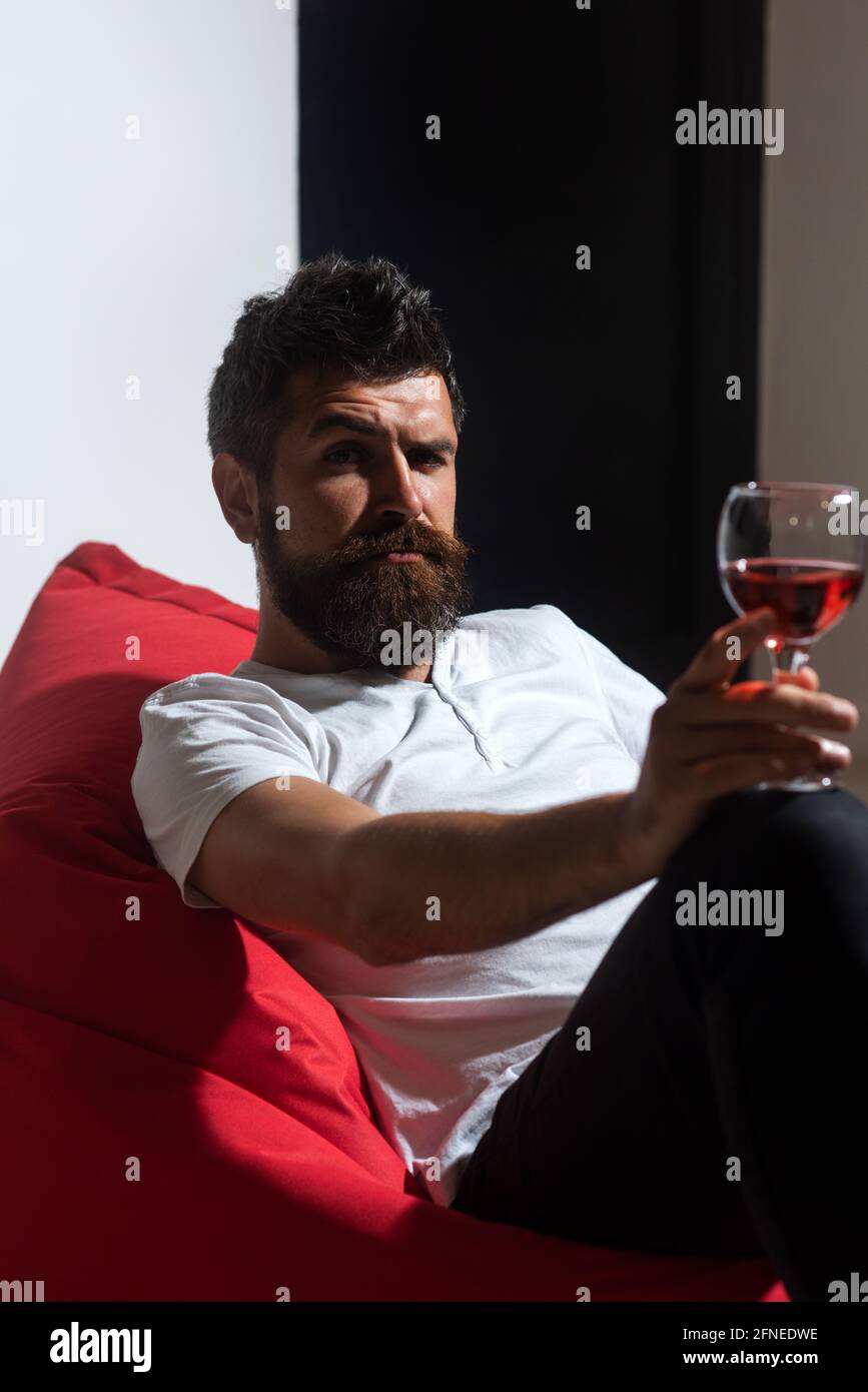 Man in depression drinking wine. Alcohol addiction. Home alone drunk ...