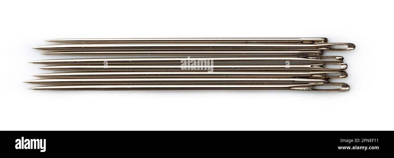 sewing needles isolated on a white background Stock Photo - Alamy