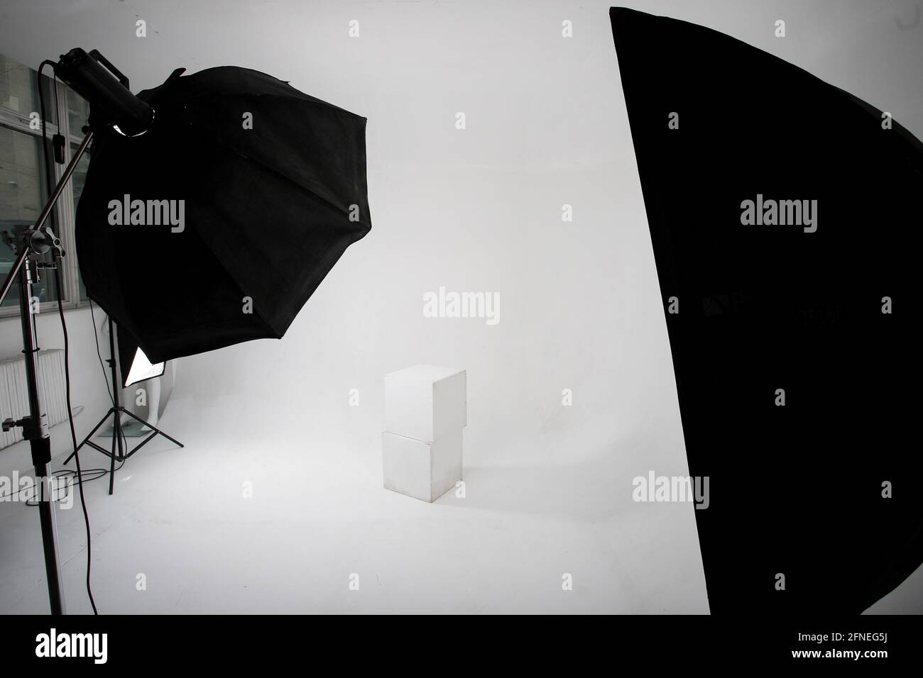 Photo studio, lighting fixtures, white endless background, white cubes ...