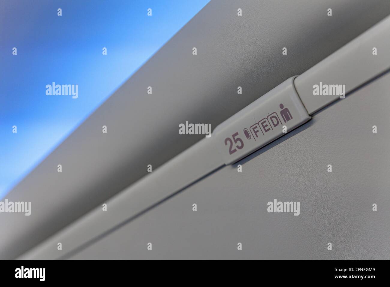 Sign of seat number with number and letter on luggage shell inside ...