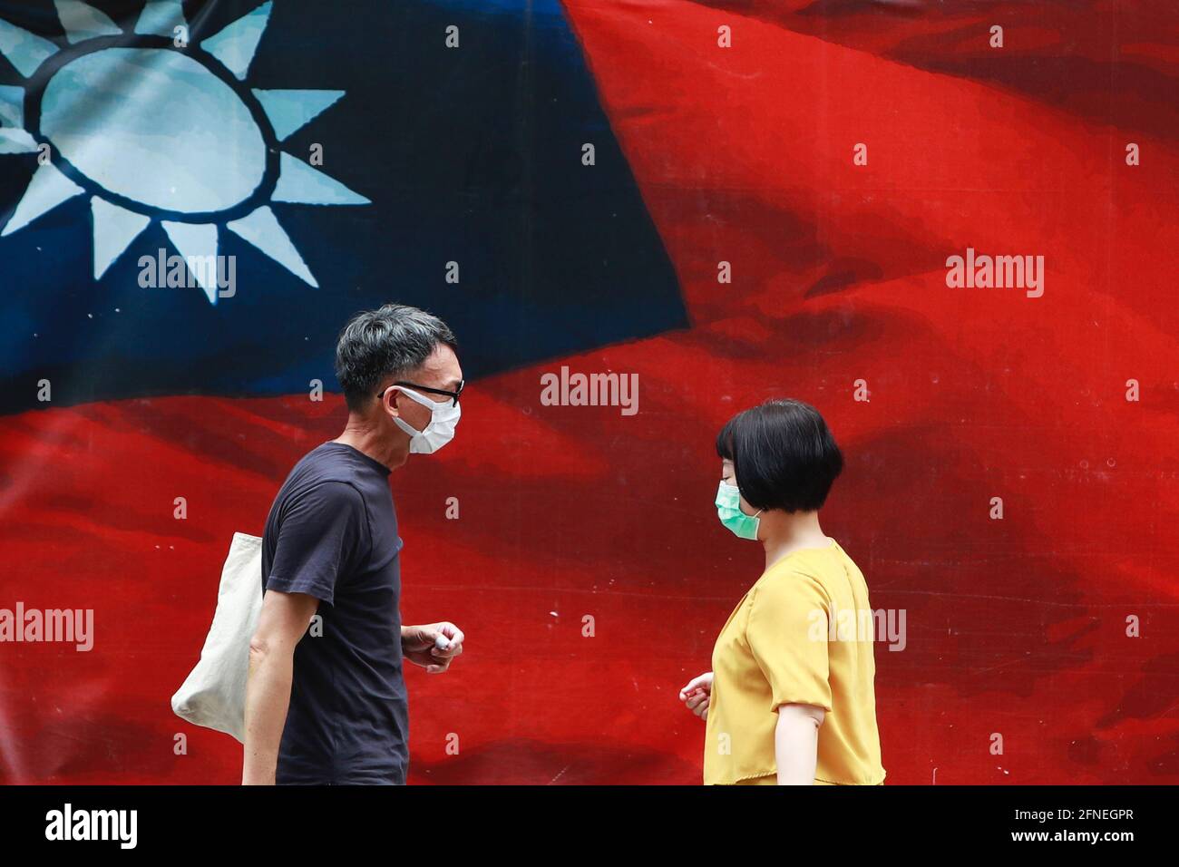 Taipei, Taipei, Taiwan. 17th May, 2021. People wearing a face mask walk ...