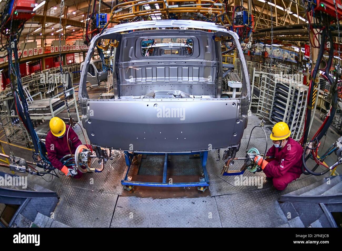 QINGZHOU, CHINA - APRIL 30, 2021 - Workers weld on the production line ...
