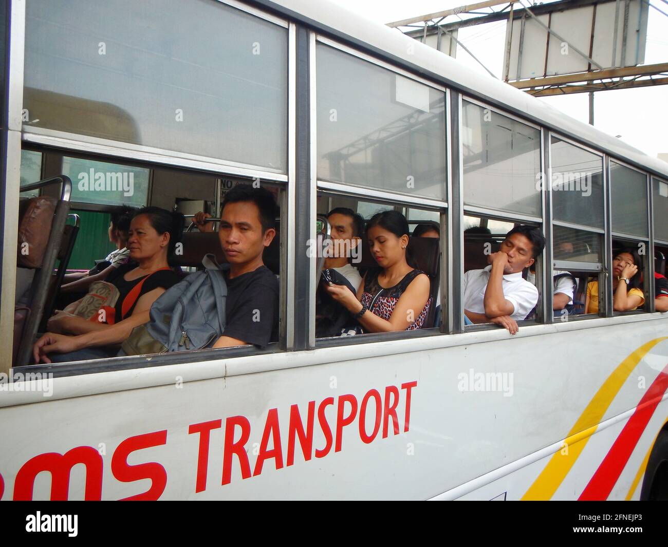Commuters riding on an aircon bus in Novaliches, Manila, Philippines ...