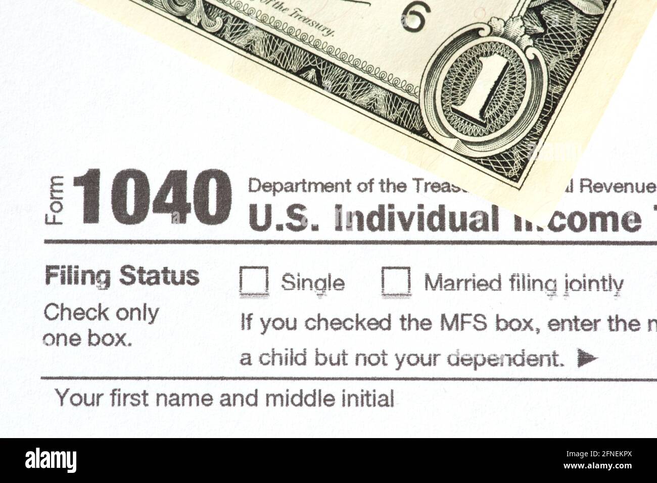 Dollar bank note and 1040 tax return in America Stock Photo - Alamy