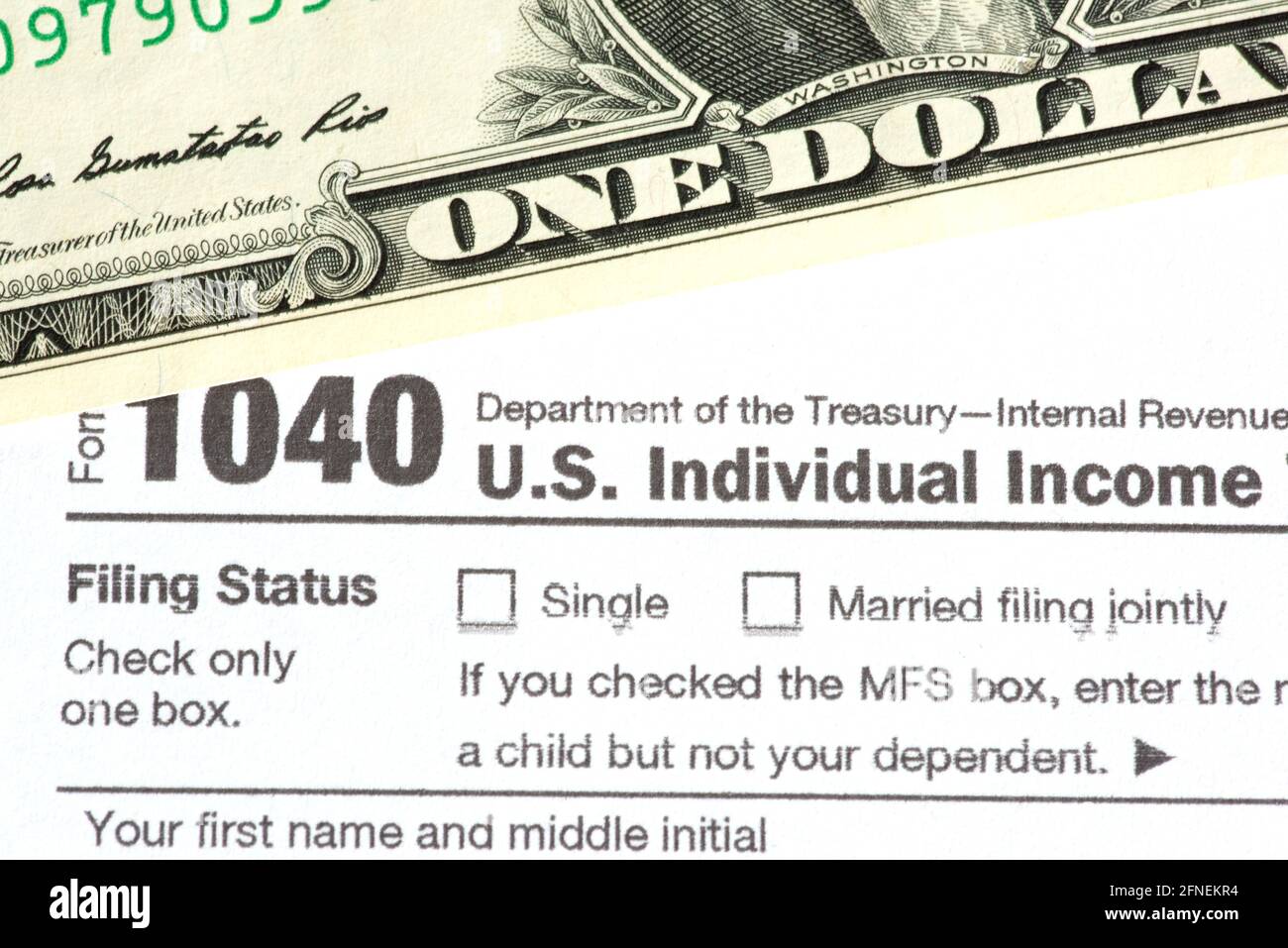 Dollar bank note and 1040 tax return in America Stock Photo - Alamy