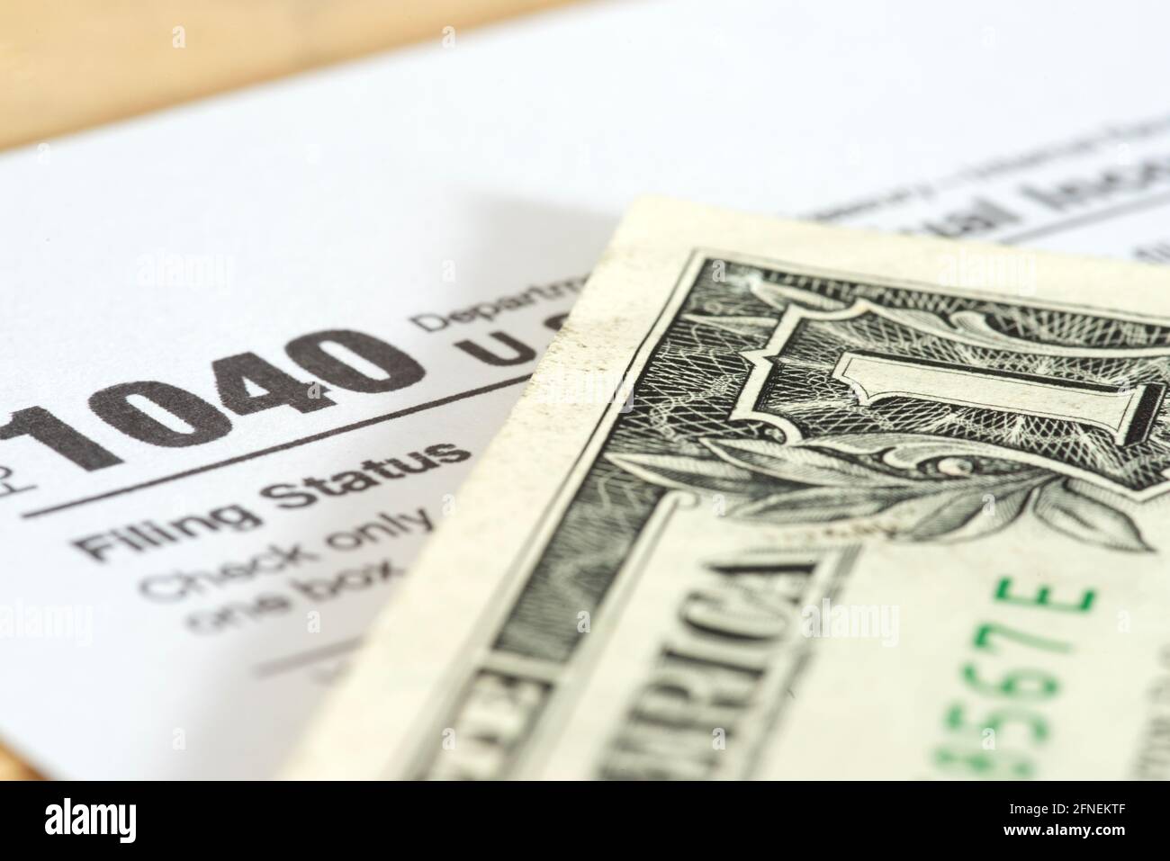 Dollar bank note and 1040 tax return in America Stock Photo - Alamy