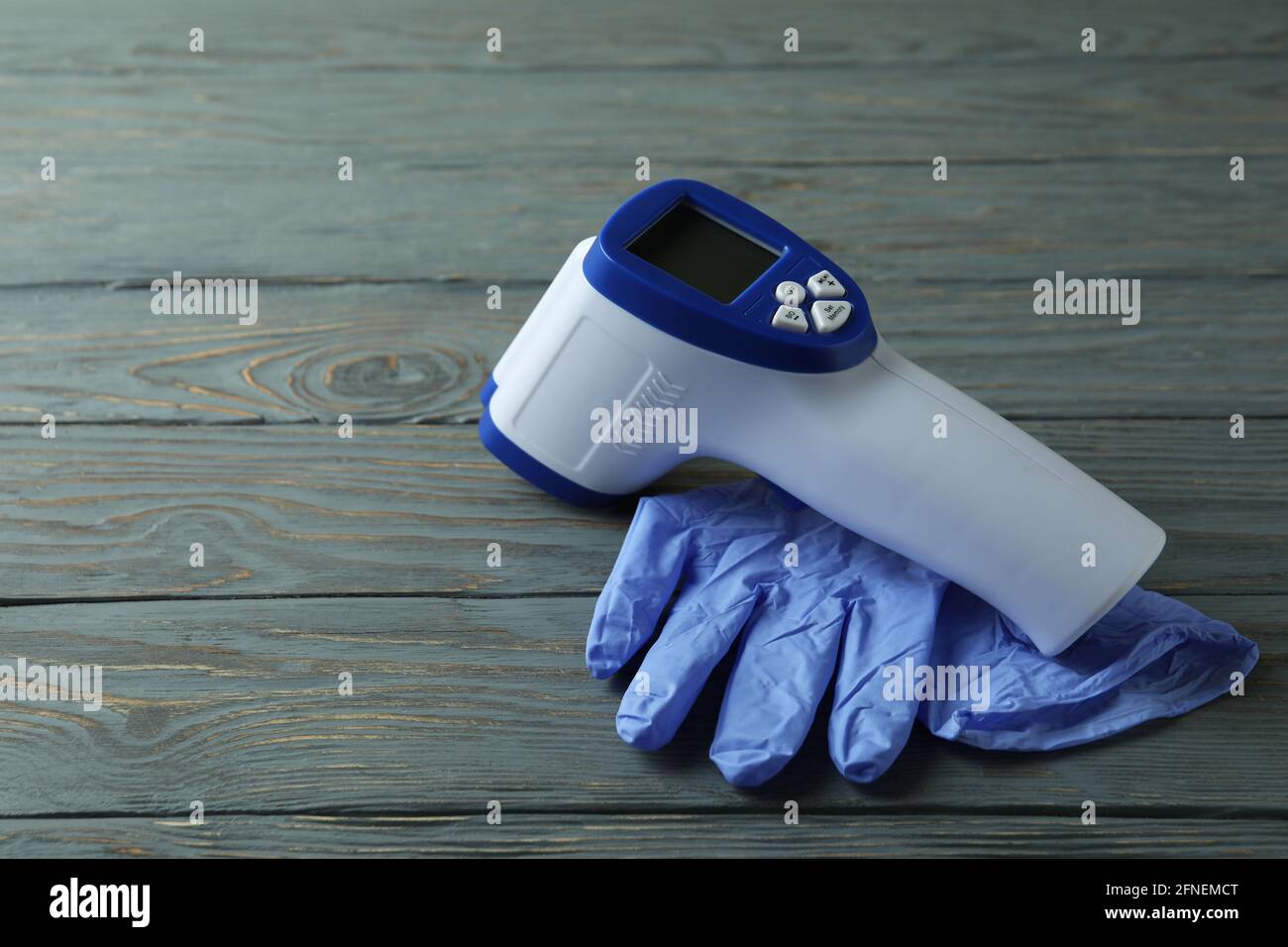 Medical glove thermometer gun hi-res stock photography and images - Alamy
