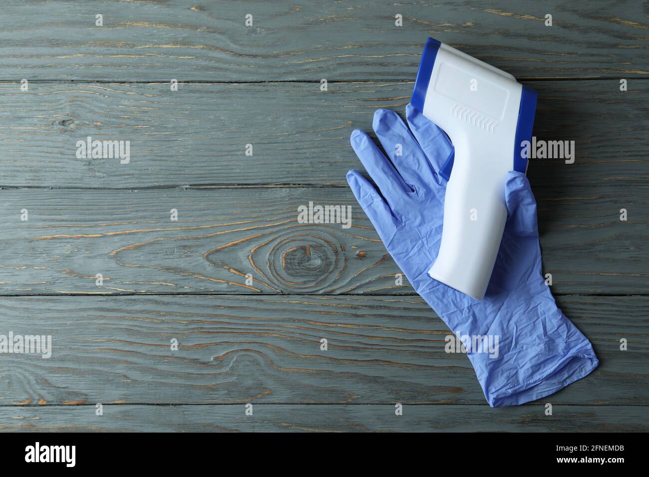 Medical glove thermometer gun hi-res stock photography and images - Alamy