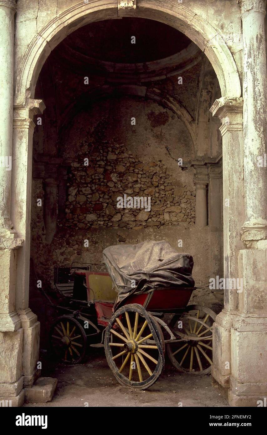 A parked carriage in a corner of the old town of Réthimnon, an old ...