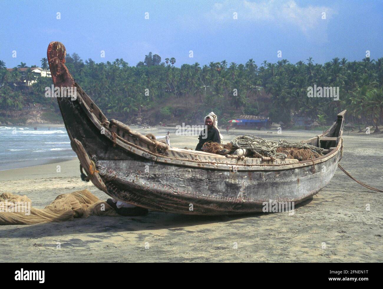 Fishermen at Kovalam Beach in Kerala. Fishing and coconut plantations ...